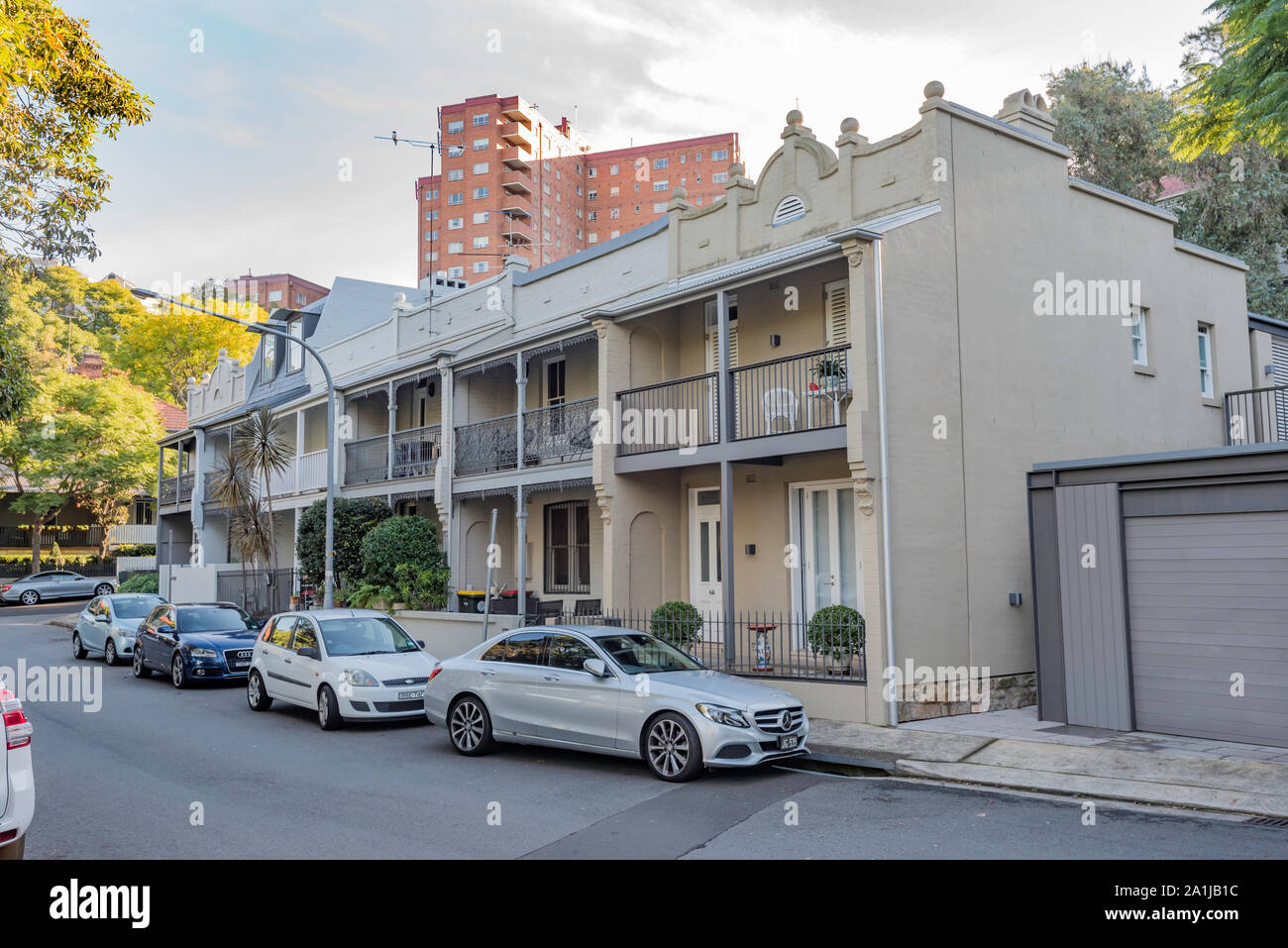 A continuous row of five 1908 two-storey terrace houses of brick with ...