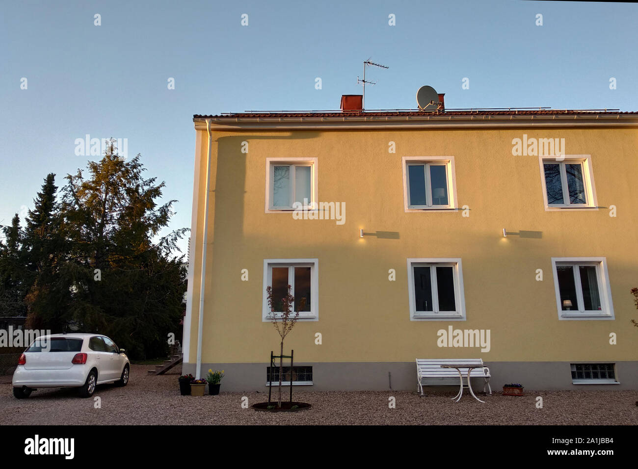Car parked on a side of the street in quiet rural area of residential ...