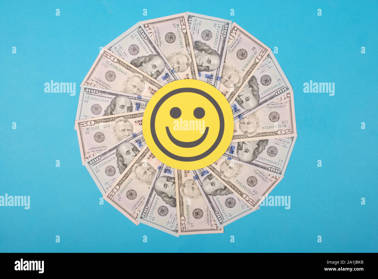 Smile faces on kaleidoscope from money. Abstract money background ...