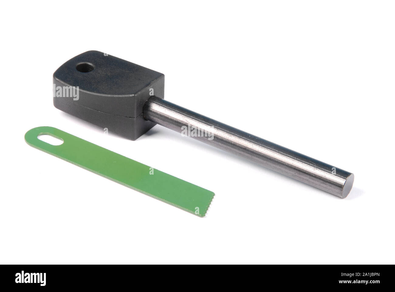 Flint fire steel and a brace, travel equipment, isolated on a white ...