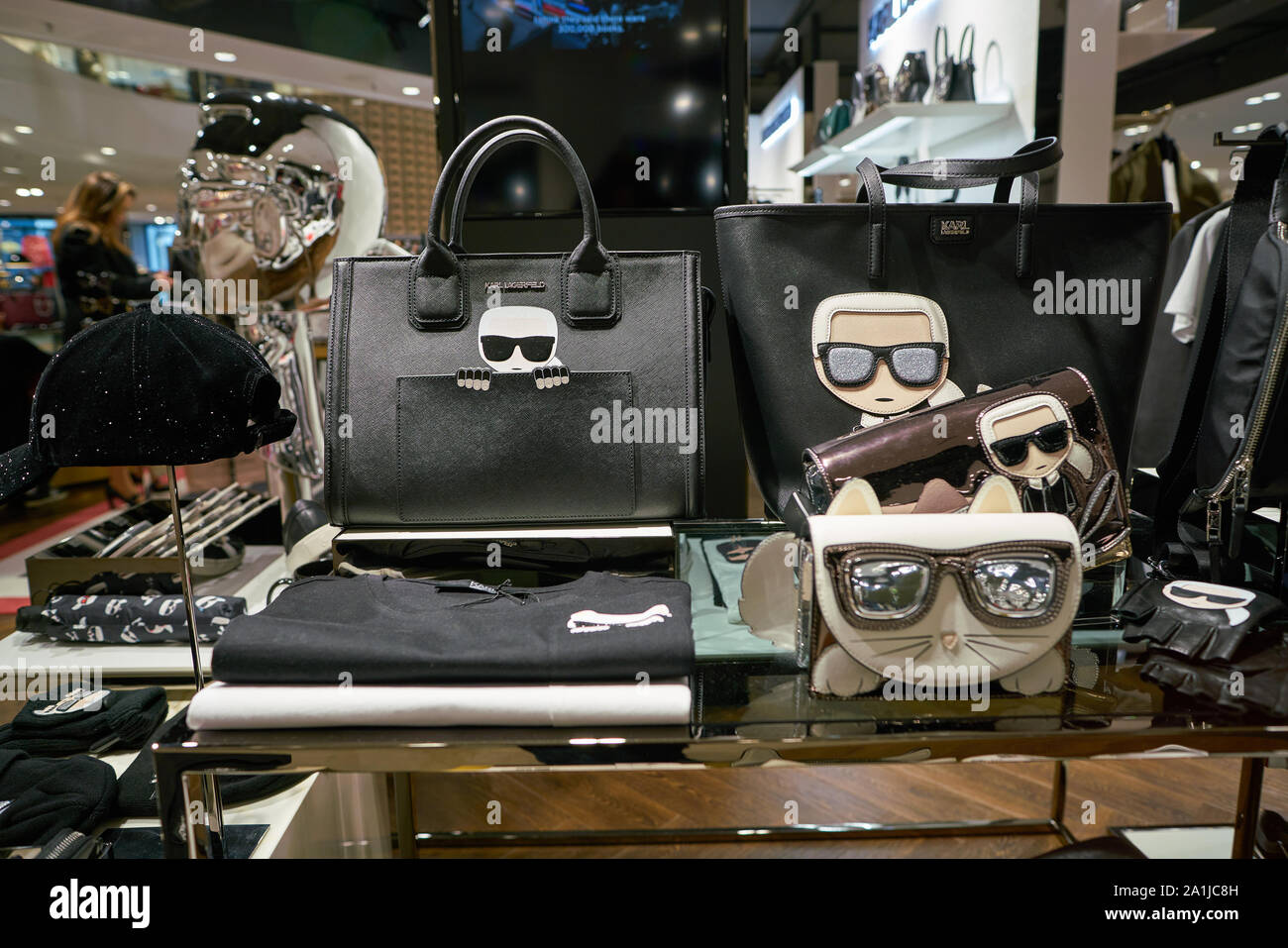 Shopping inside interior department store handbags display sale hi-res ...