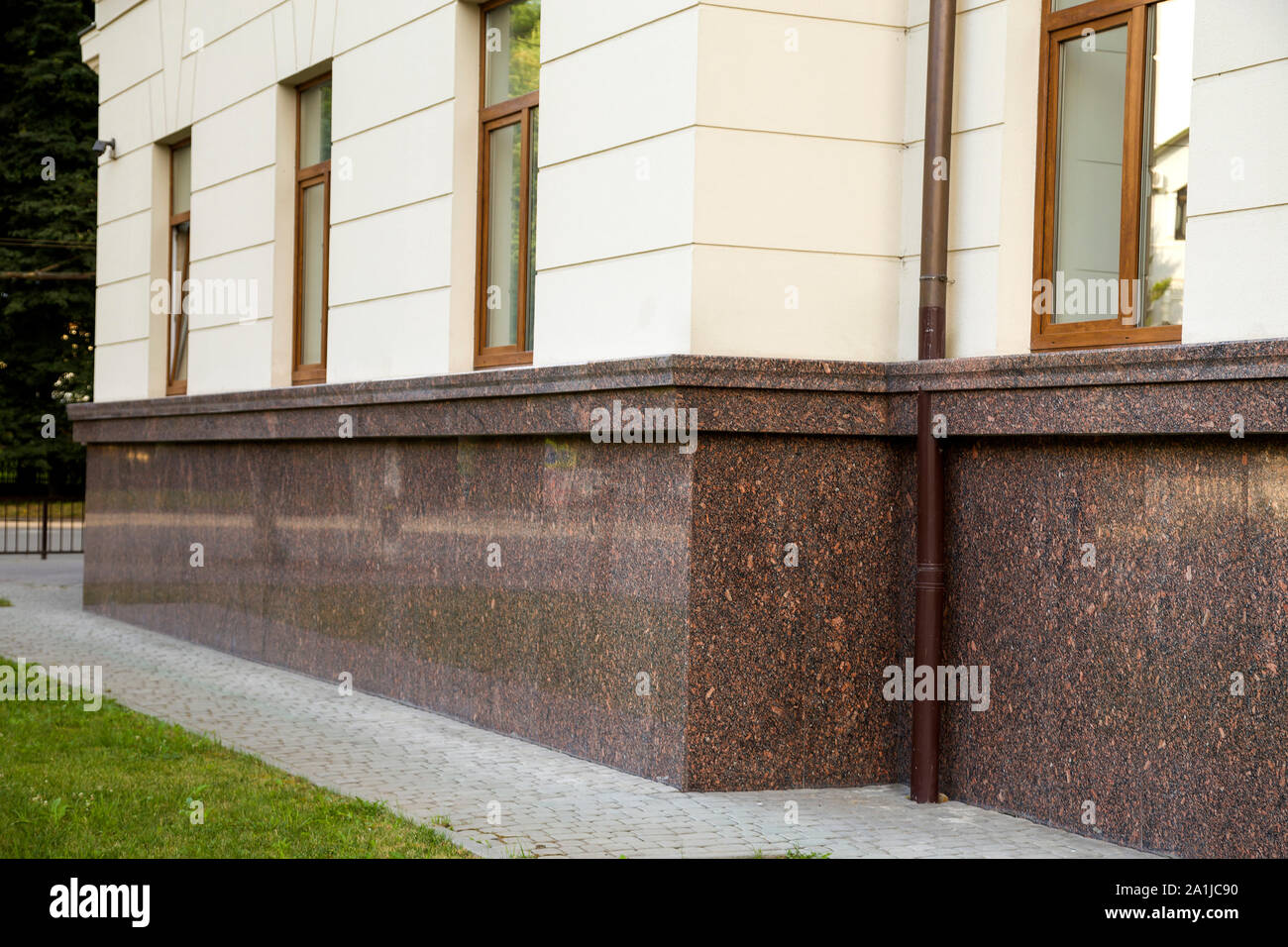 Close up view of part of a building facade with the surface of granite ...