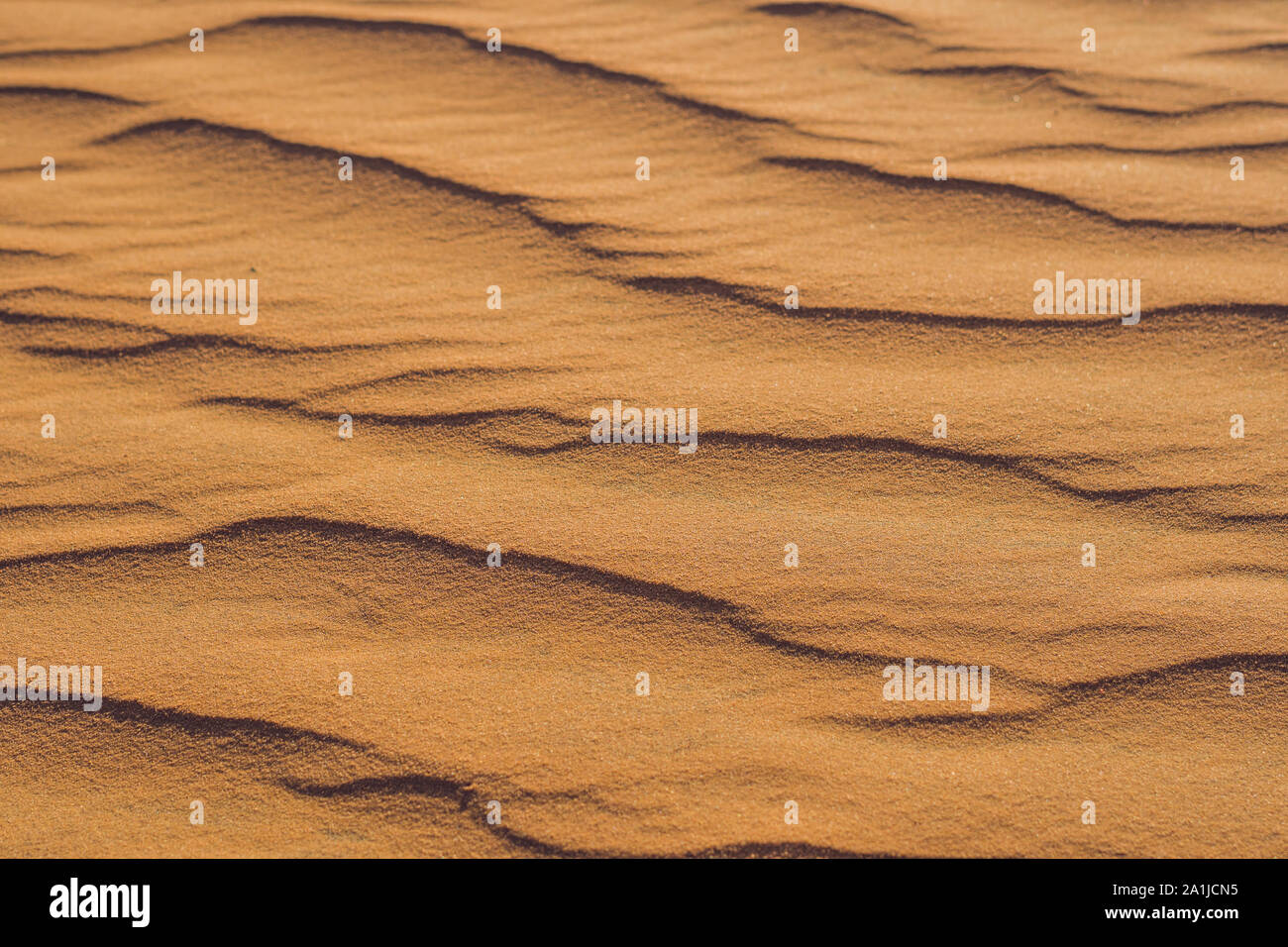 Sand with waves in the red desert Stock Photo - Alamy