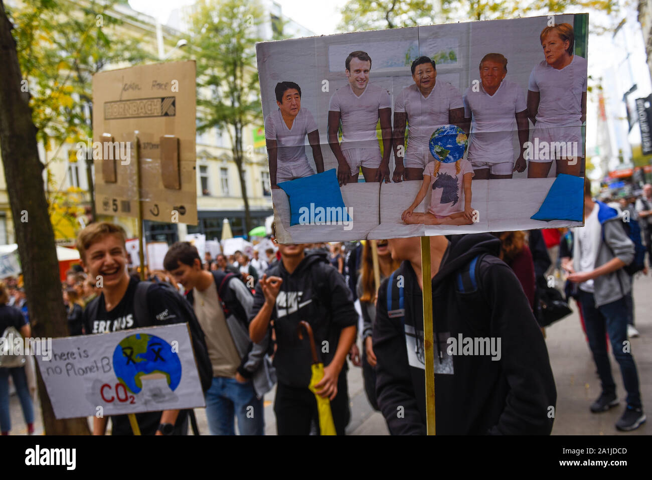 A protester holds portraits during the march.In more than 150 countries ...