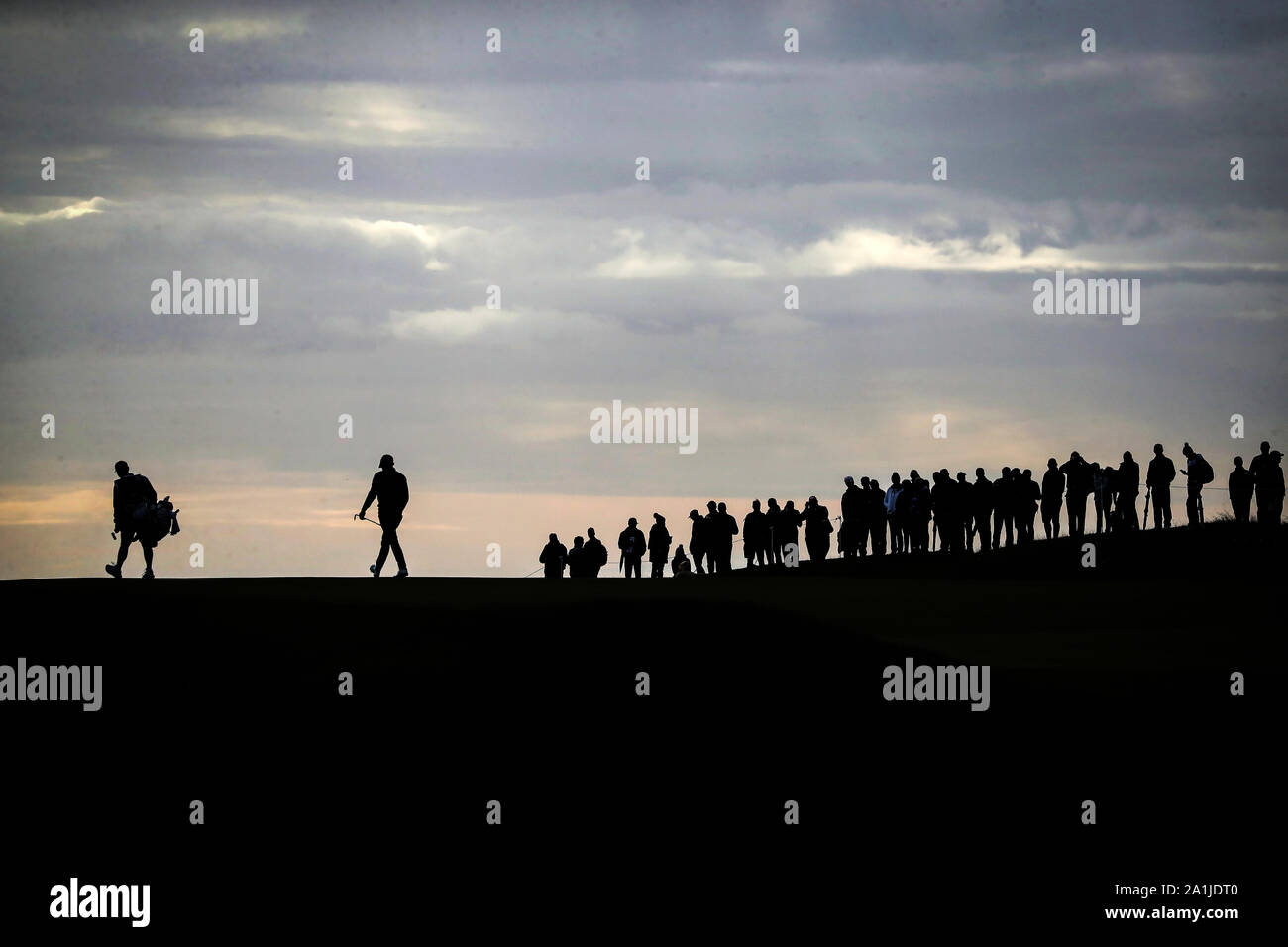 Caddie walk across onto 4th green hi-res stock photography and images ...