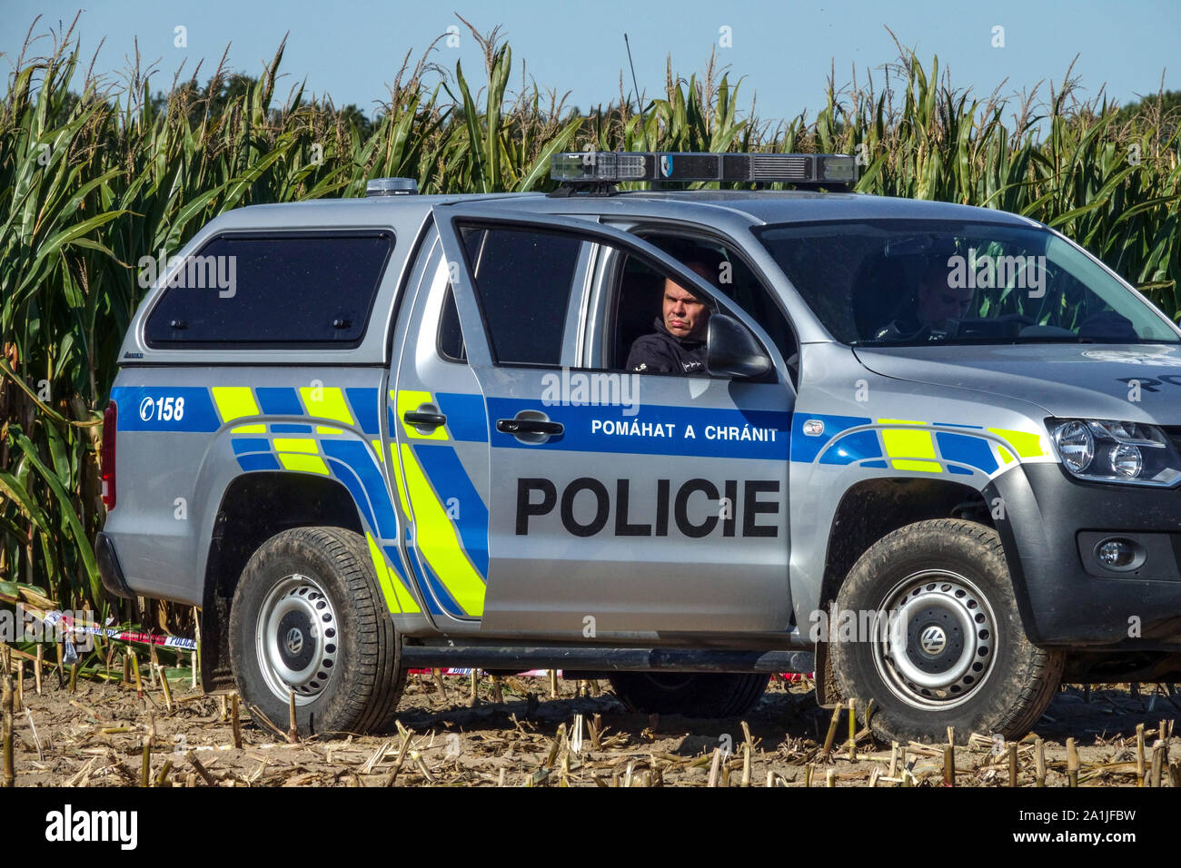 Czech police car patrolling at corn field, Czech Republic Stock Photo ...