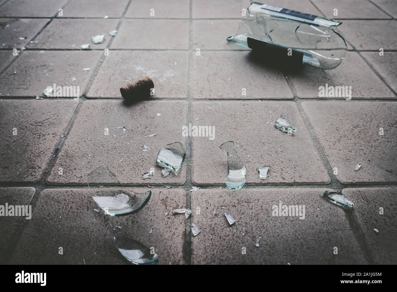 Piece of broken glass on the floor, wine bottle Stock Photo - Alamy