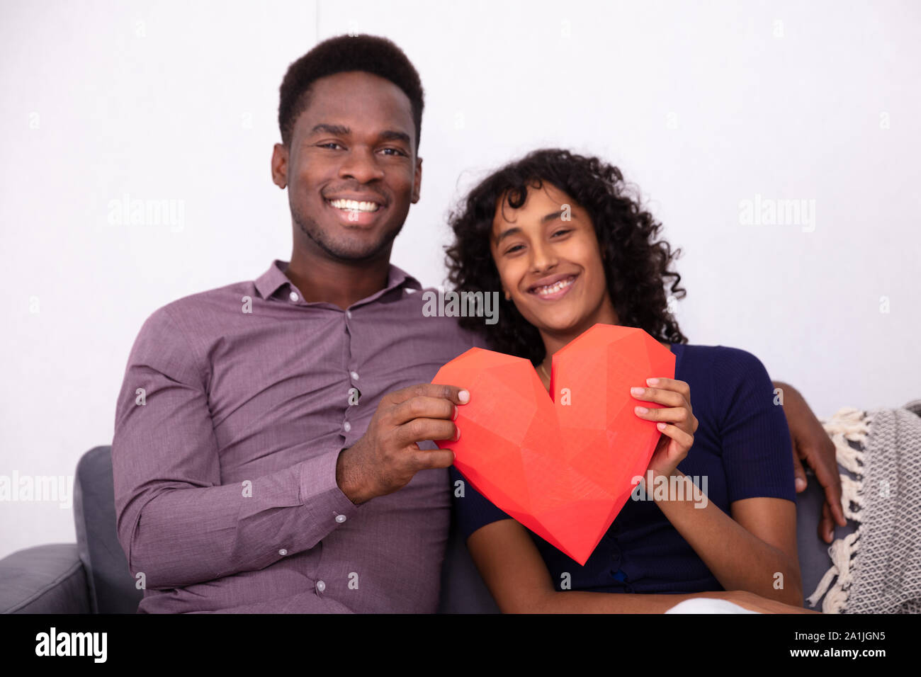 Couple red heart home hi-res stock photography and images - Alamy