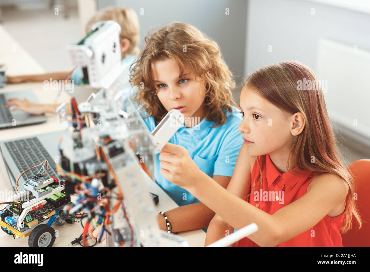 Boy fixing robot hi-res stock photography and images - Alamy