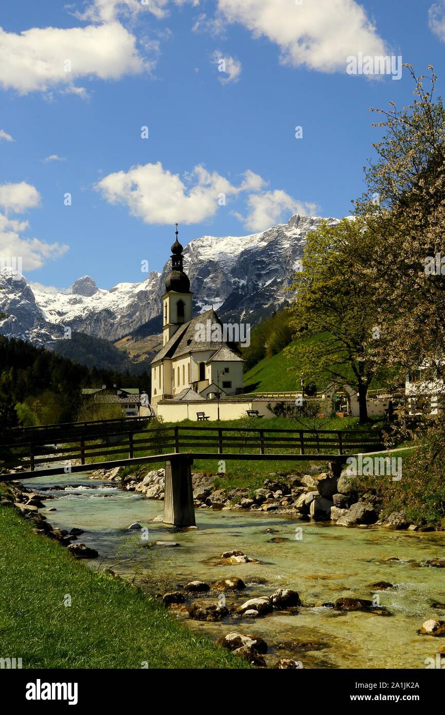 Parish church St. Sebastian in spring with Ramsauer Ache, Reiteralpe at ...