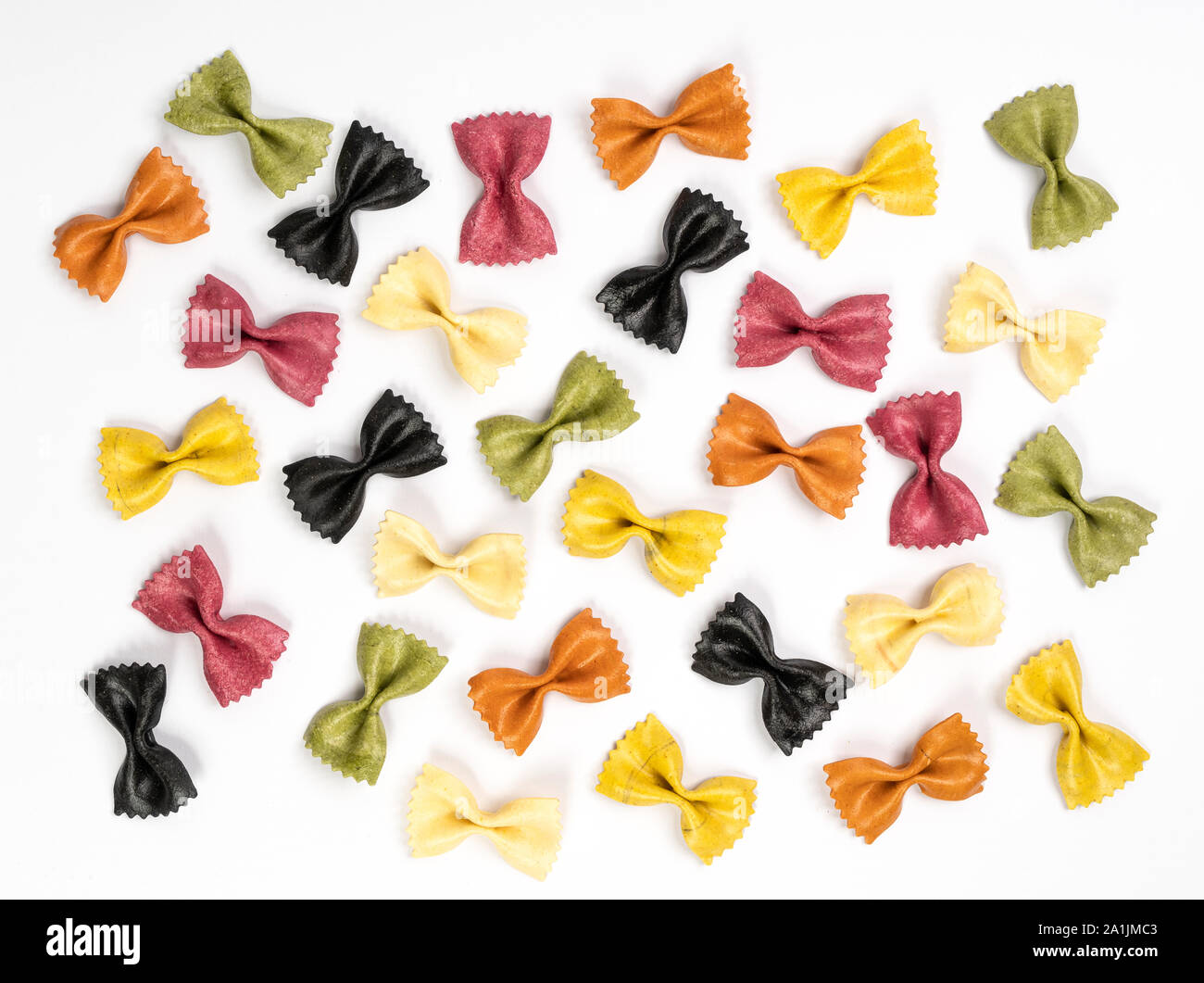 butterfly-shaped Italian pasta of various colors produced naturally ...