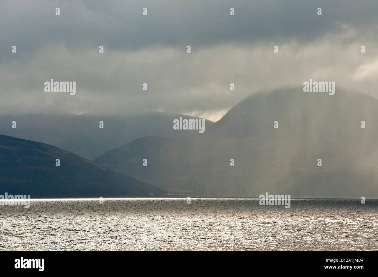 Rain showers sweeping over coastal mountains of Isle of Arran. Scotland ...