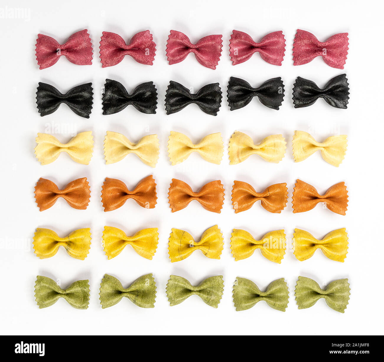 butterfly-shaped Italian pasta of various colors produced naturally ...
