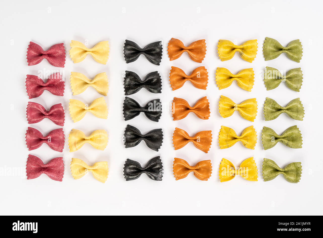 butterfly-shaped Italian pasta of various colors produced naturally ...