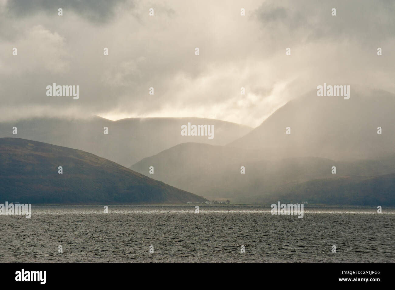Rain showers sweeping over coastal mountains of Isle of Arran. Scotland ...