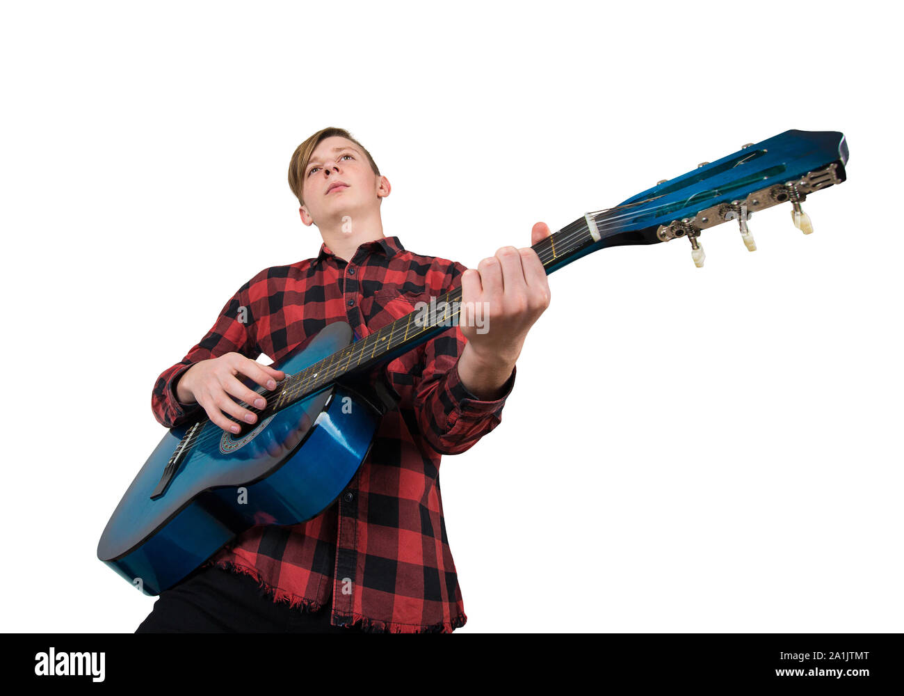 Handsome teenage guy playing on the acoustic guitar isolated over white ...