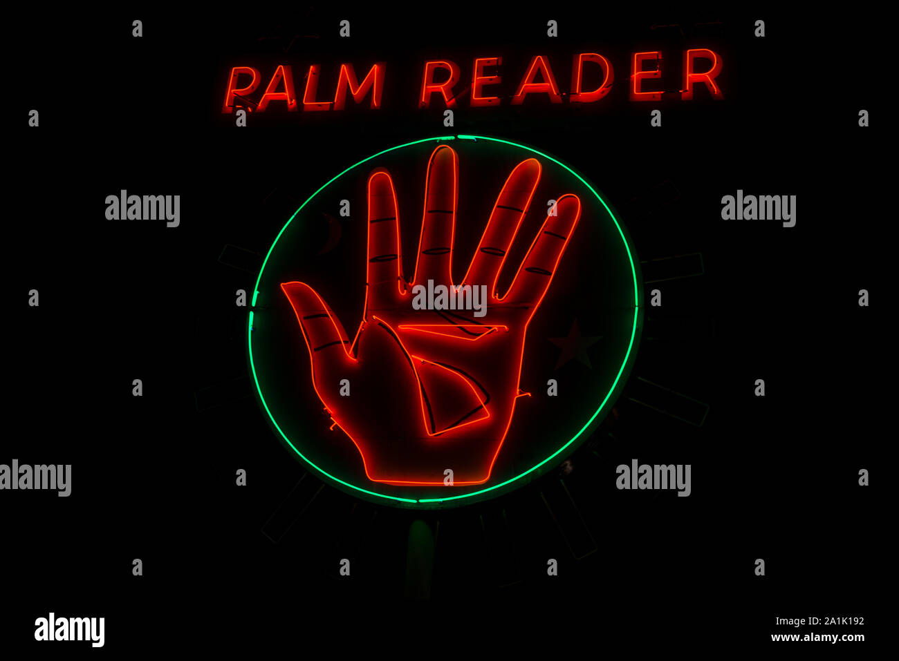 Neon sign advertising the services of Madam Sophia, a palm reader in ...