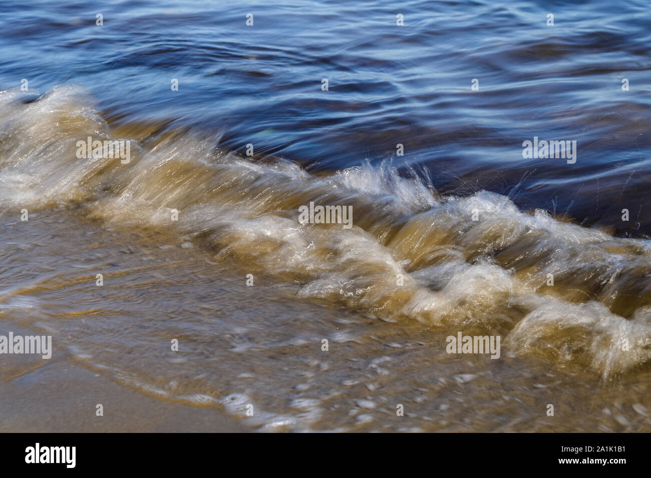 Waves on the seashore captured with a slow shutter speed. Natural ...