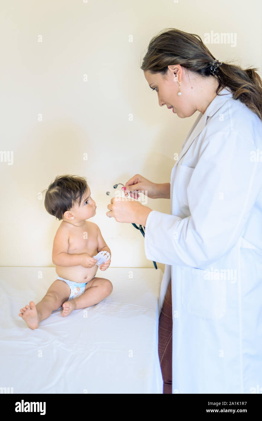 Doctor passing a baby girl's check-up at the hospital Stock Photo - Alamy