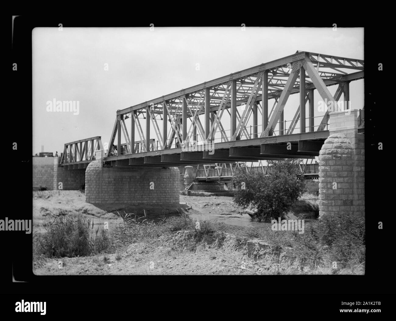 New Allenby Bridge over Jordan, showing old bridge also Stock Photo - Alamy