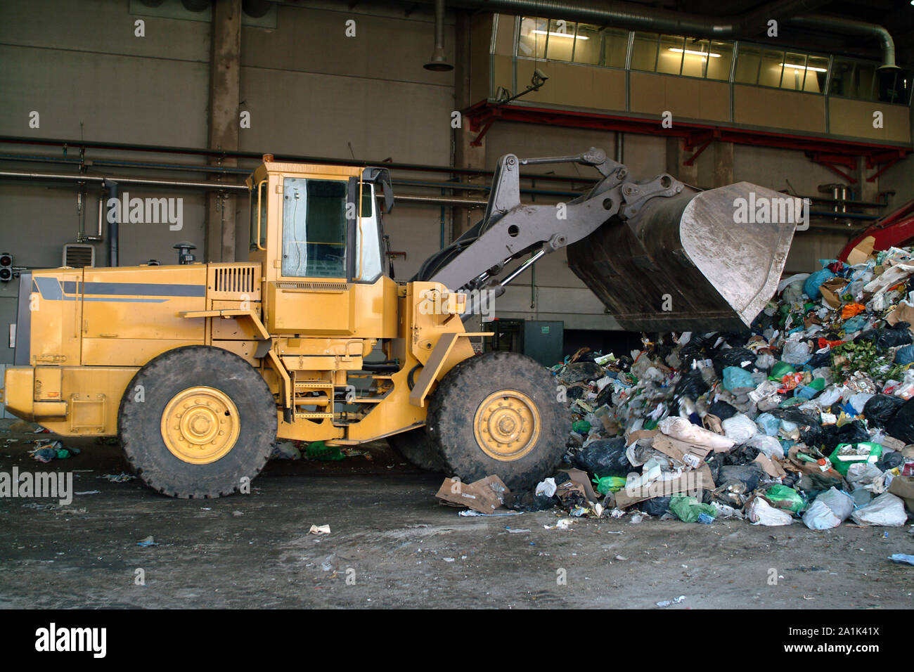 Bulldozer move pile of waste in a landfill Stock Photo - Alamy
