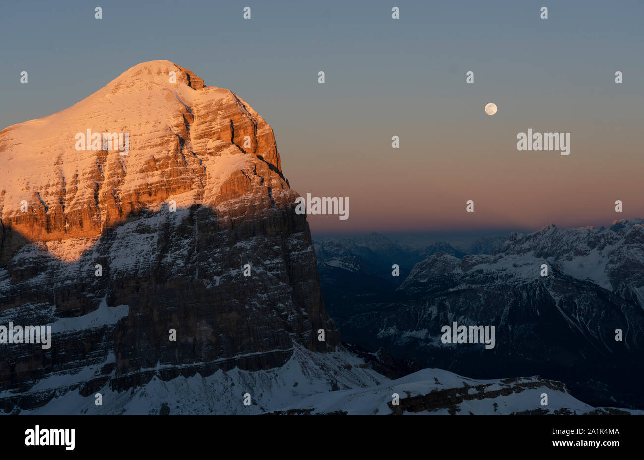 mountain moonrise and sunset in same photograph Stock Photo - Alamy