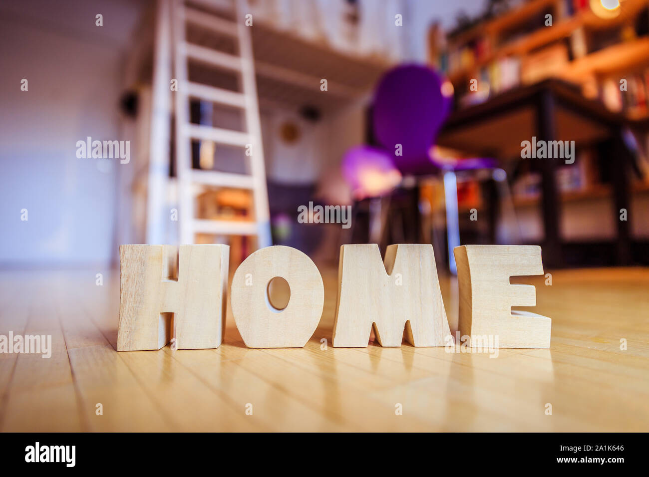 Wooden HOME Letters on the floor of an apartment Stock Photo - Alamy