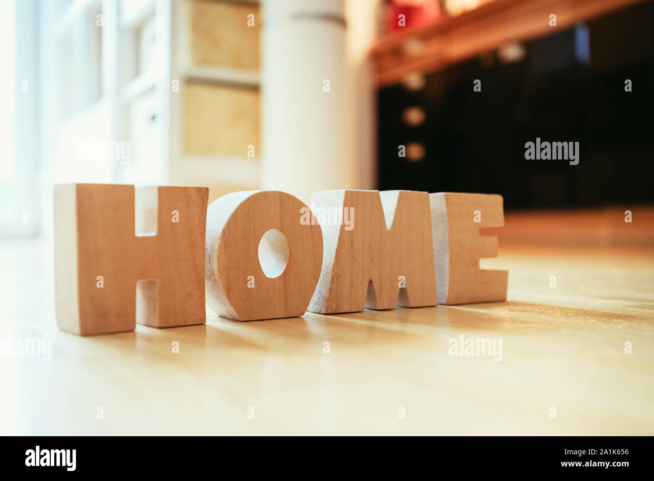 Wooden HOME Letters on the floor of an apartment Stock Photo - Alamy