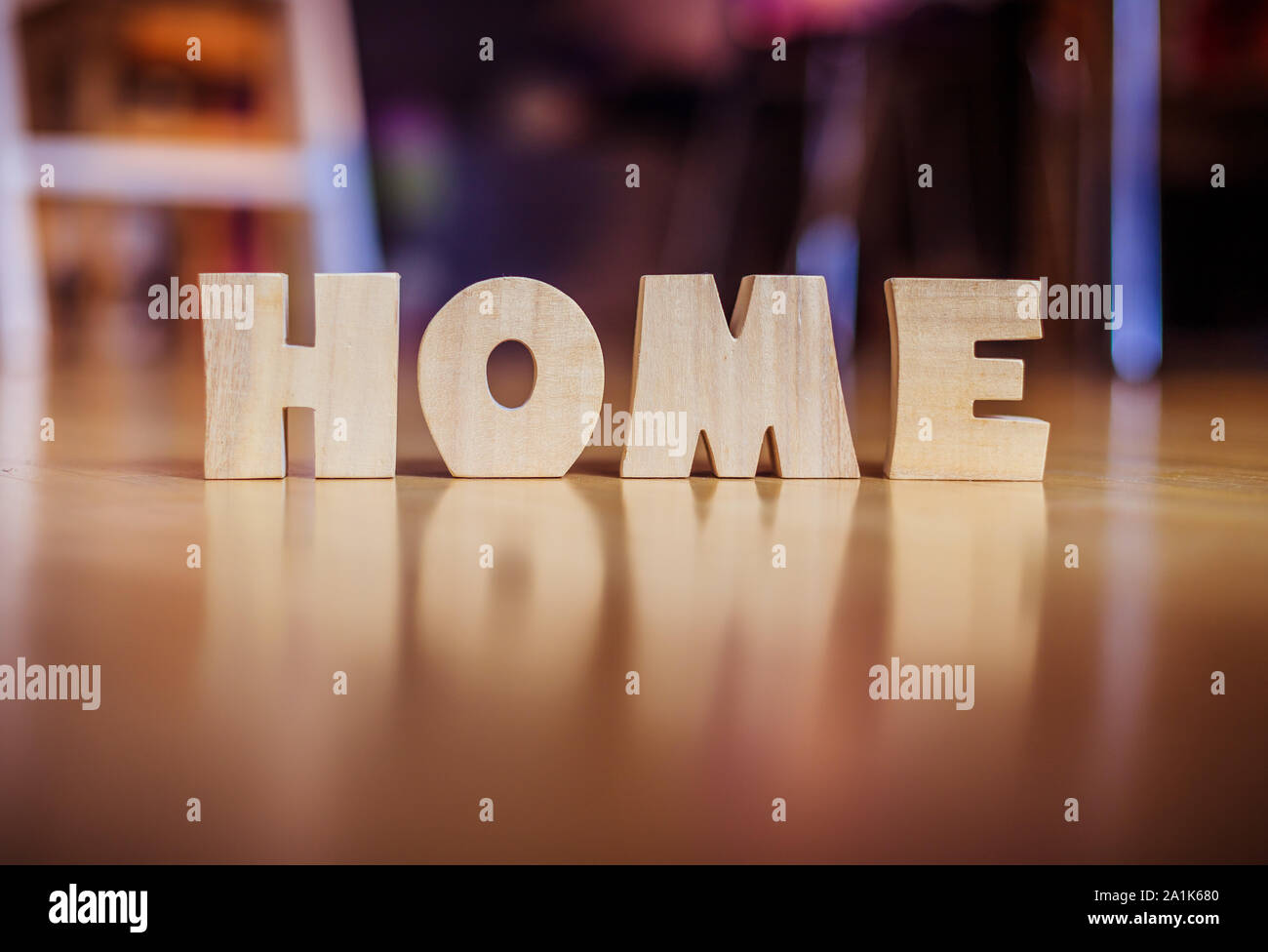 Wooden HOME Letters on the floor of an apartment Stock Photo - Alamy