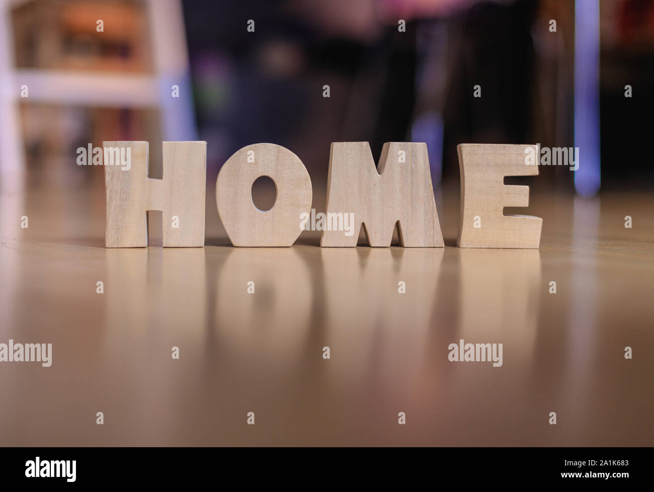 Wooden HOME Letters on the floor of an apartment Stock Photo - Alamy
