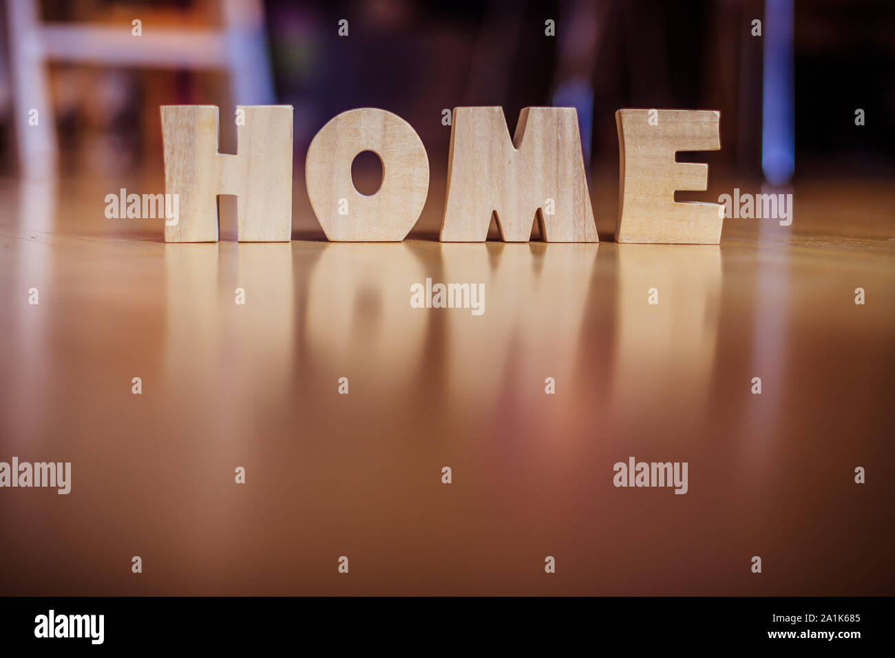 Wooden HOME Letters on the floor of an apartment Stock Photo - Alamy