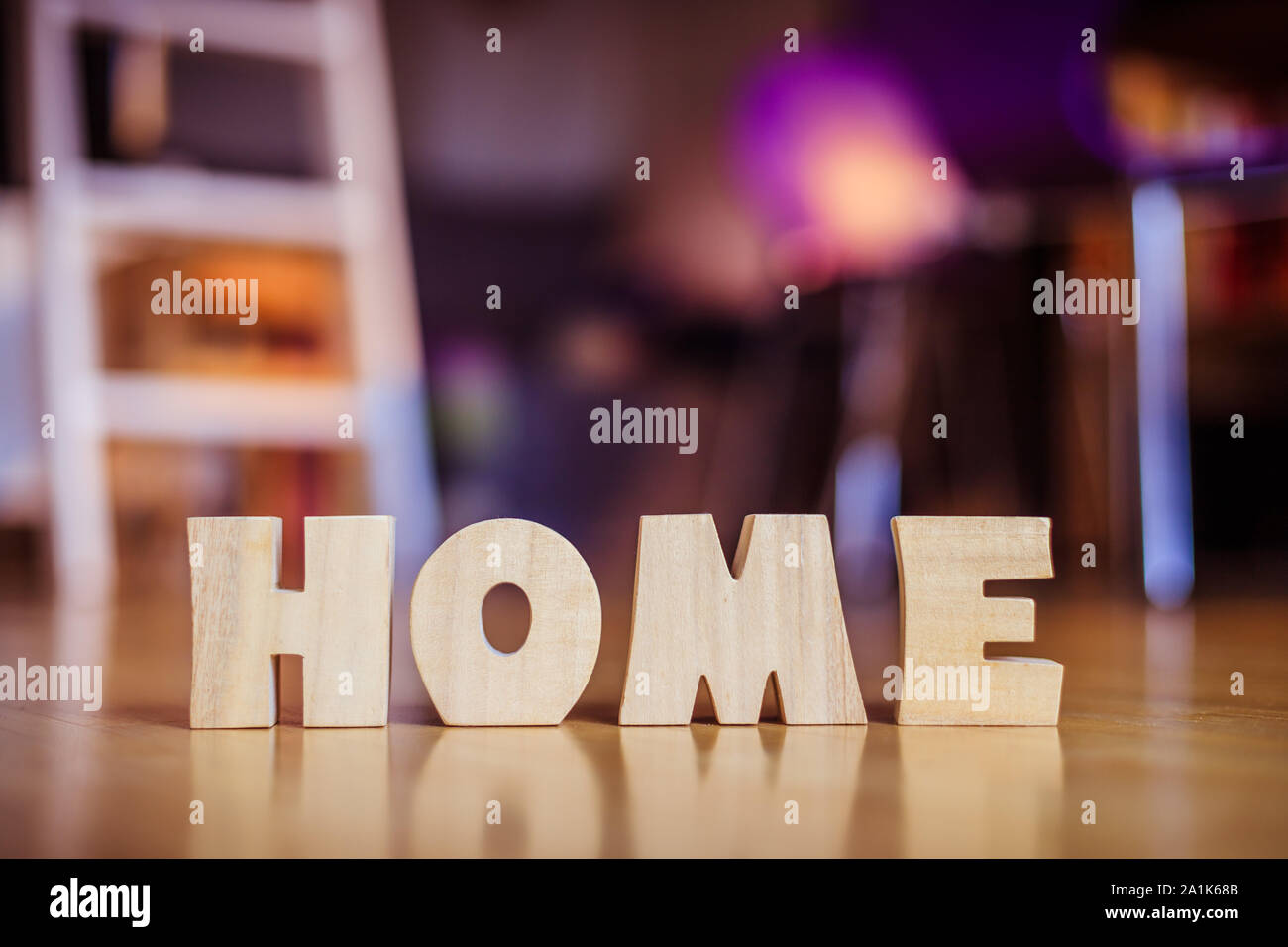 Wooden HOME Letters on the floor of an apartment Stock Photo - Alamy