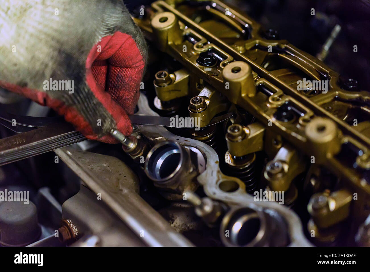 Auto mechanic repair engine in a car repair shop. Close up of cylinder ...