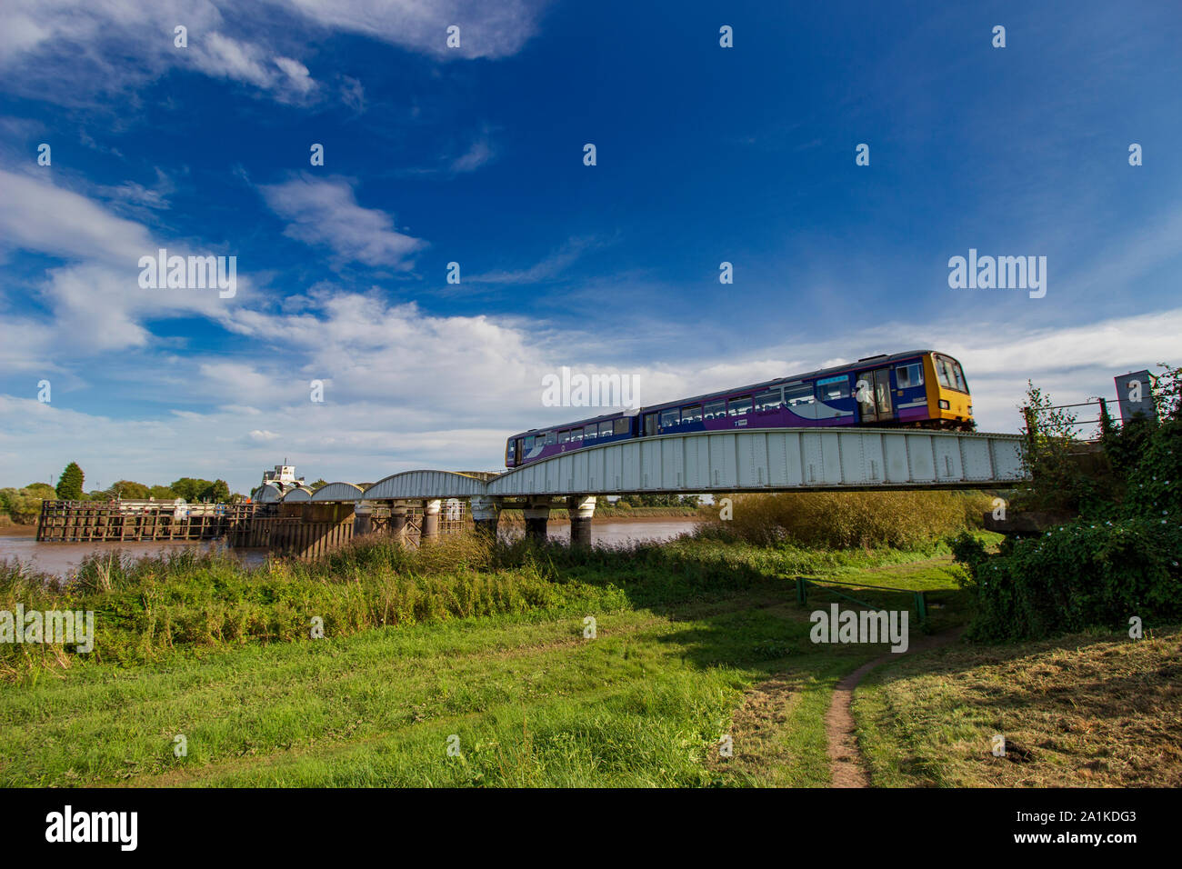 Railway Bridge over River with Train crossing Stock Photo - Alamy