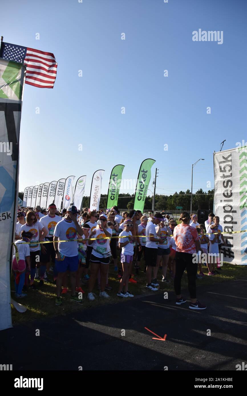 This photograph was taken at the 2019 Color Run 5K road race. These ...