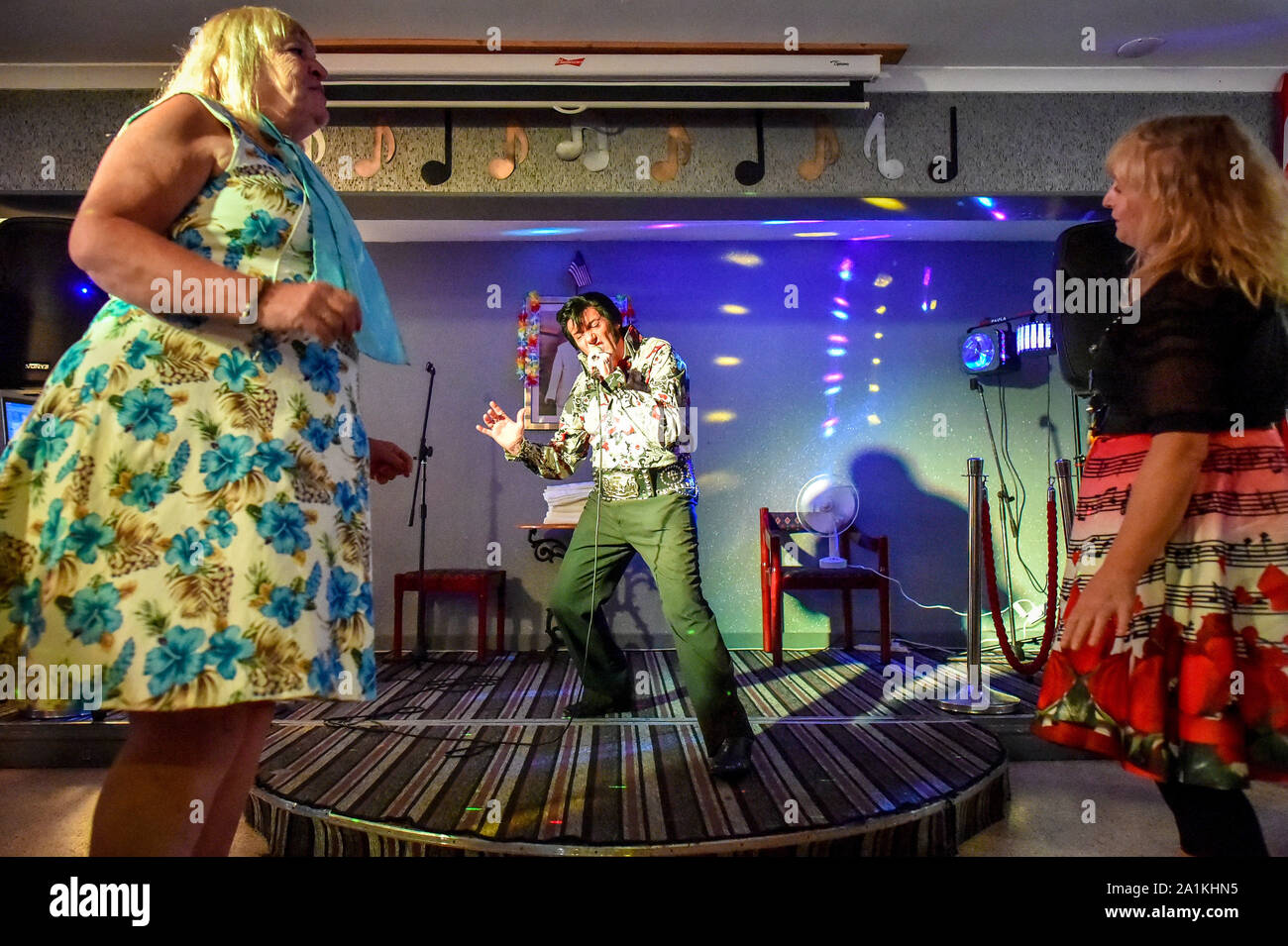 People dance to an Elvis performer inside a pub at the annual Porthcawl ...
