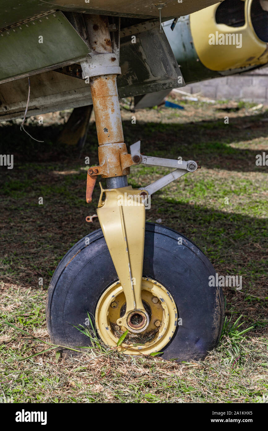 Front wheel of wrecked and abandoned aircraft in Saint Vincent and the ...