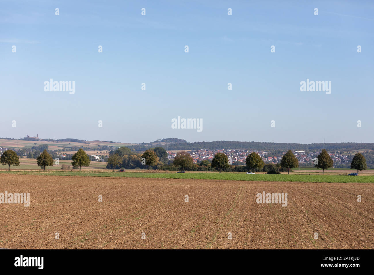 German countryside landscape: series of trees with hills as background ...
