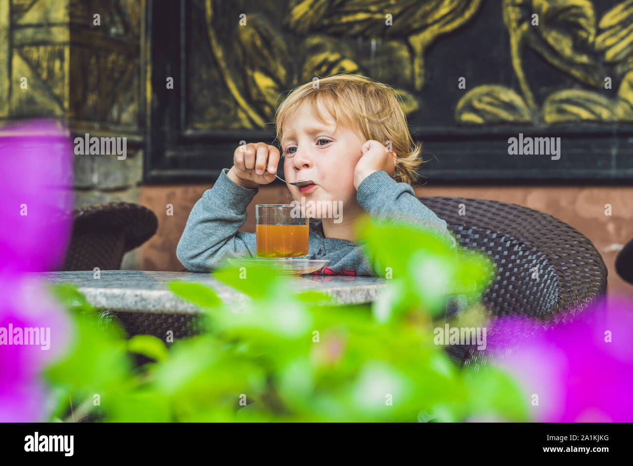 Little boy drinking tea hi-res stock photography and images - Alamy
