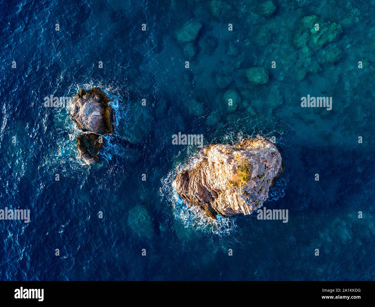 Aerial view of a seabed with rocks emerging from the sea, seabed seen ...