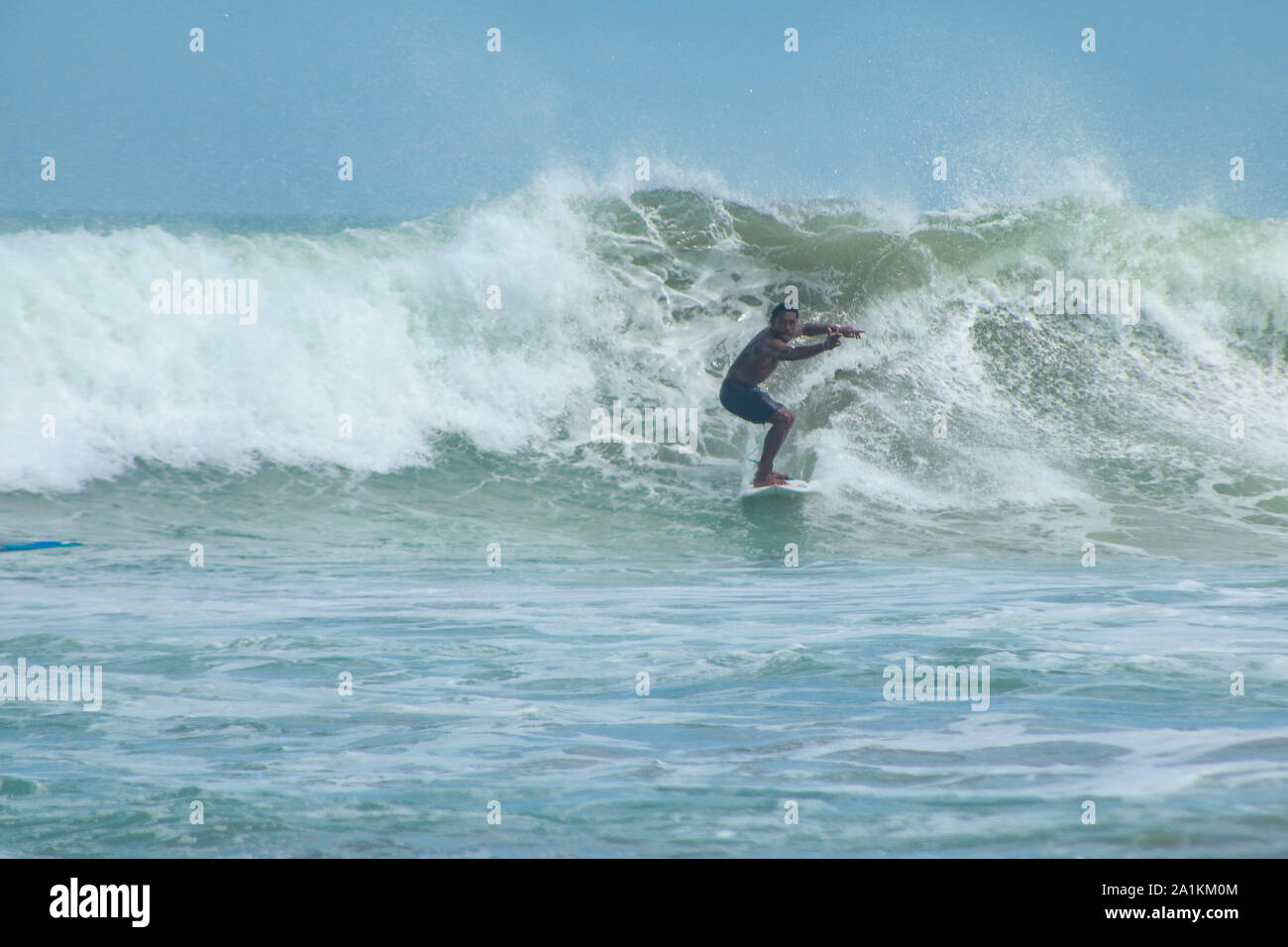Kuta Beach, Bali 2019. Local surfer spent the day with wave Stock Photo ...