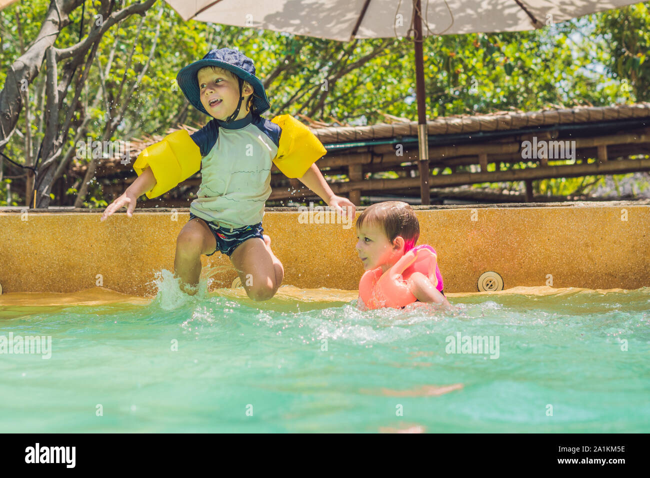 Two people water slide hi-res stock photography and images - Alamy