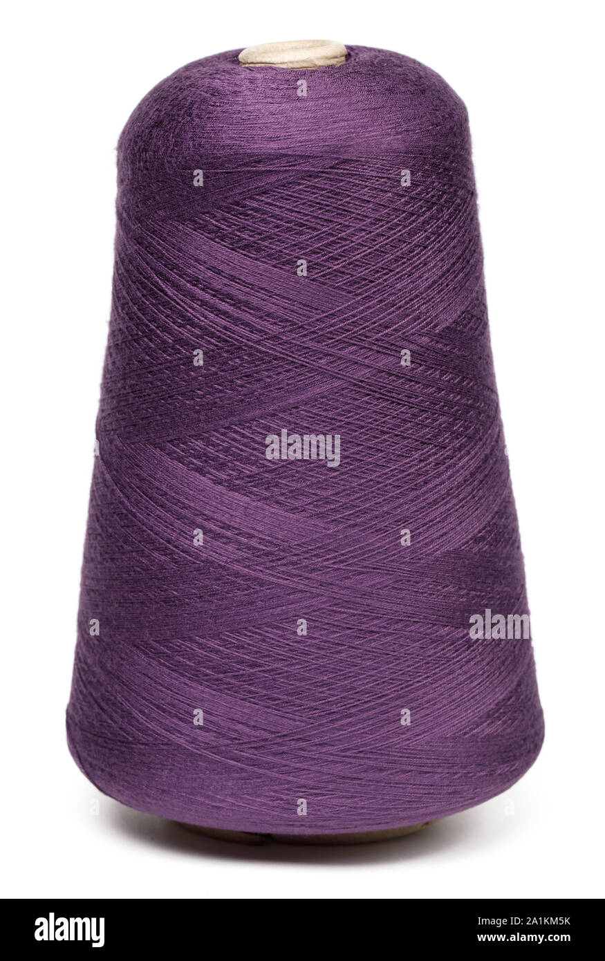 Cone of violet synthetic or cotton threads isolated on white background ...