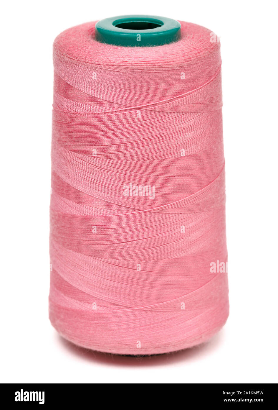 Spool of pink synthetic or cotton threads isolated on white background ...