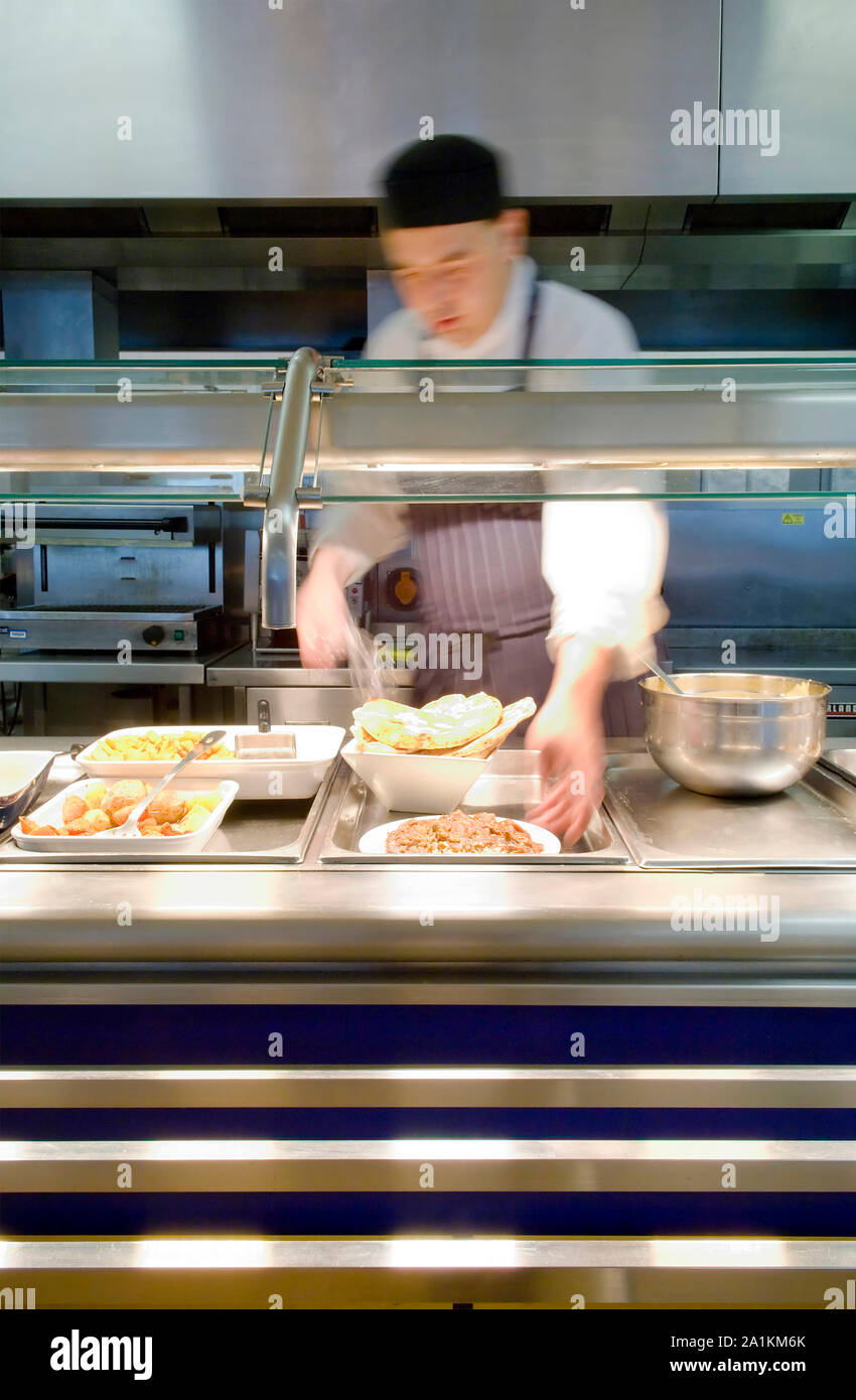A chef preparing the food counter in a cafe Stock Photo - Alamy