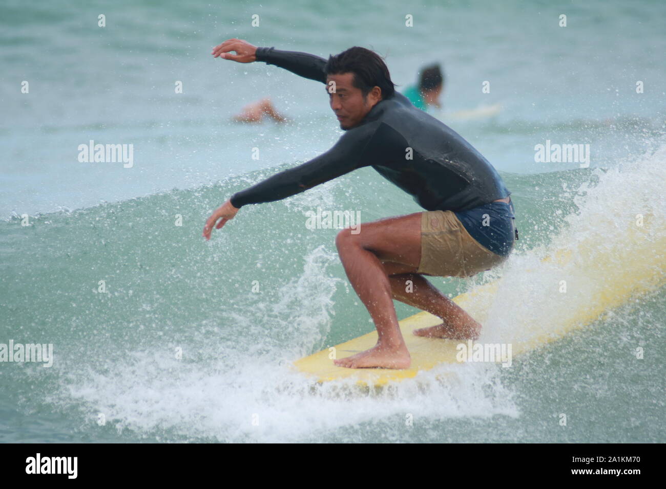 Kuta Beach, Bali 2019. Local surfer spent the day with wave Stock Photo ...