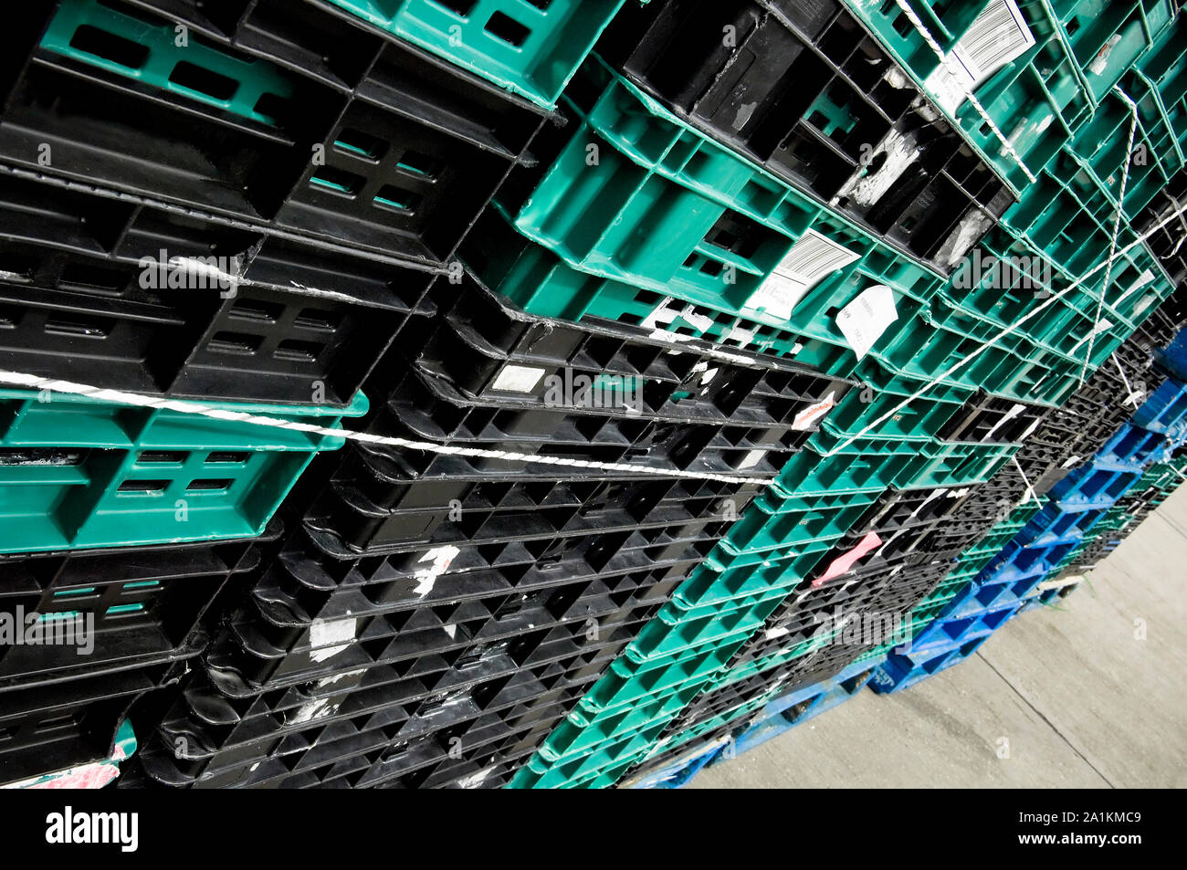 Stacks of empty plastic crates Stock Photo - Alamy