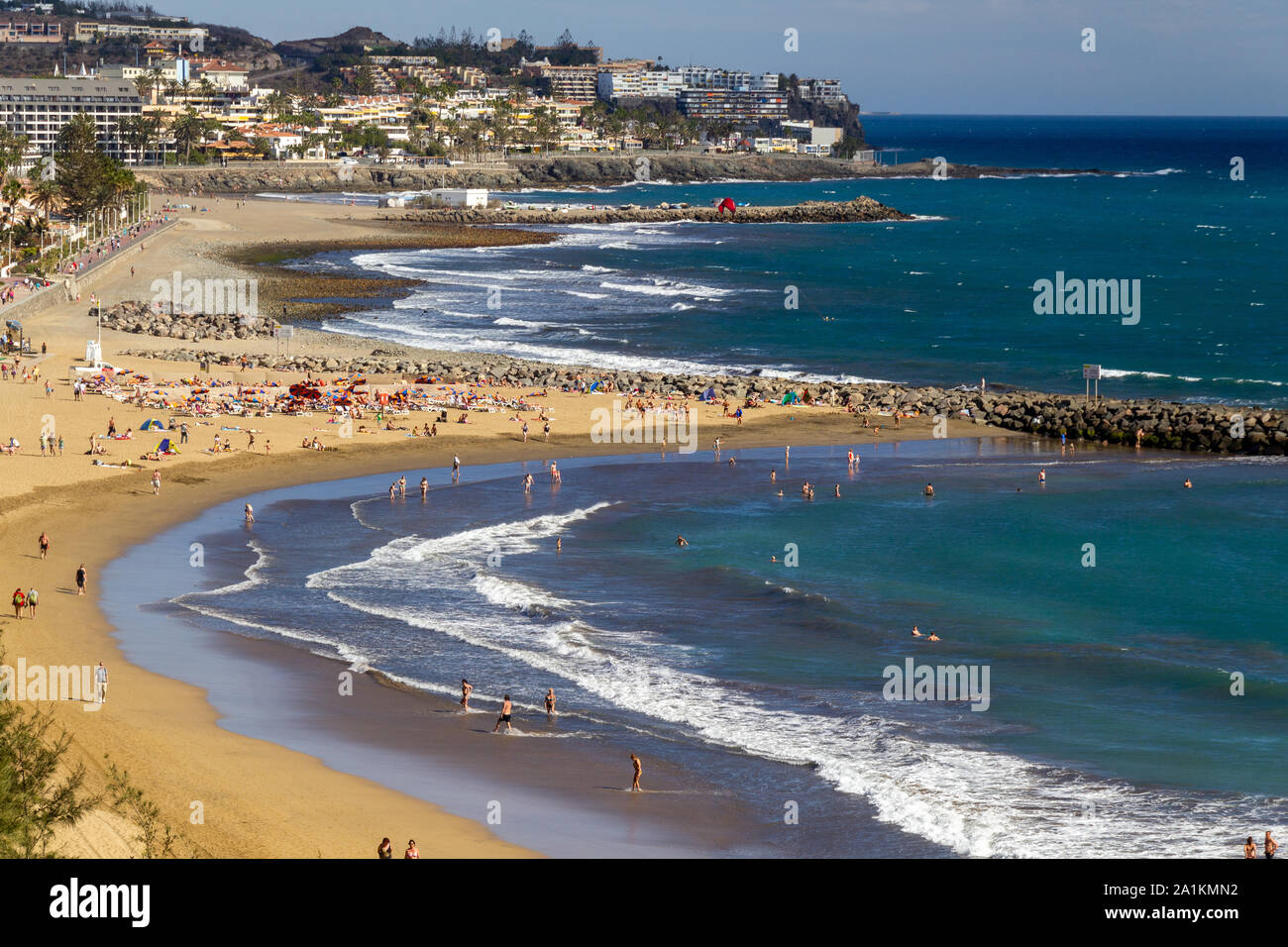 Tourists enjoying water and sun at the beaches of Playa del Ingles in ...