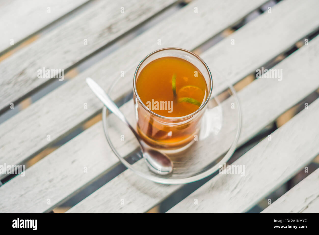 Tangerine tea on a table in a cafe Stock Photo - Alamy