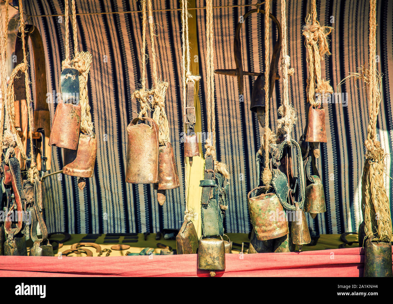 set of metal bells exposed to sell in a rural market Stock Photo - Alamy